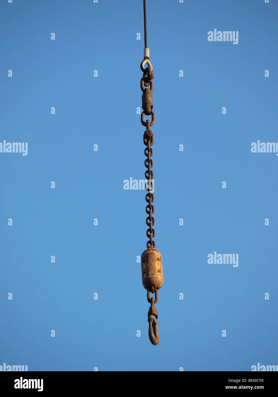 Crane hook hanging from jib Stock Photo - Alamy