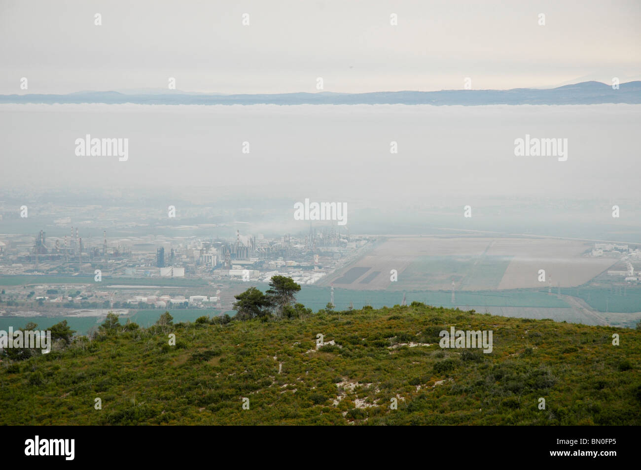 Israel, Haifa Bay Industrial area. Air Pollution the Inversion layer is ...