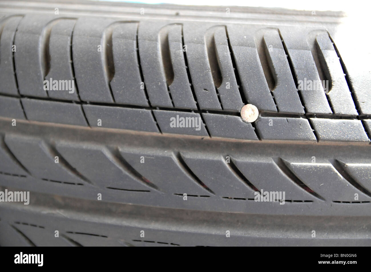 Tyre puncture nail in tyre hi-res stock photography and images - Alamy