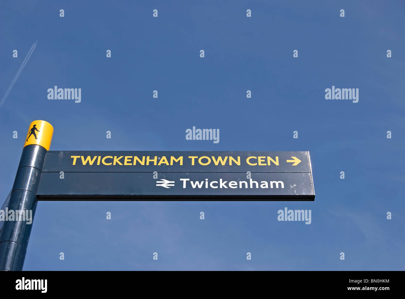 signpost showing directions for twickenham town centre and railway ...