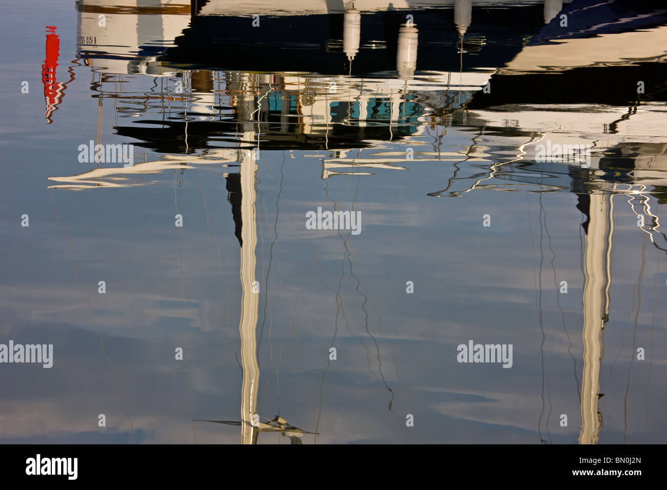 Reflections of boats in a marina Stock Photo - Alamy