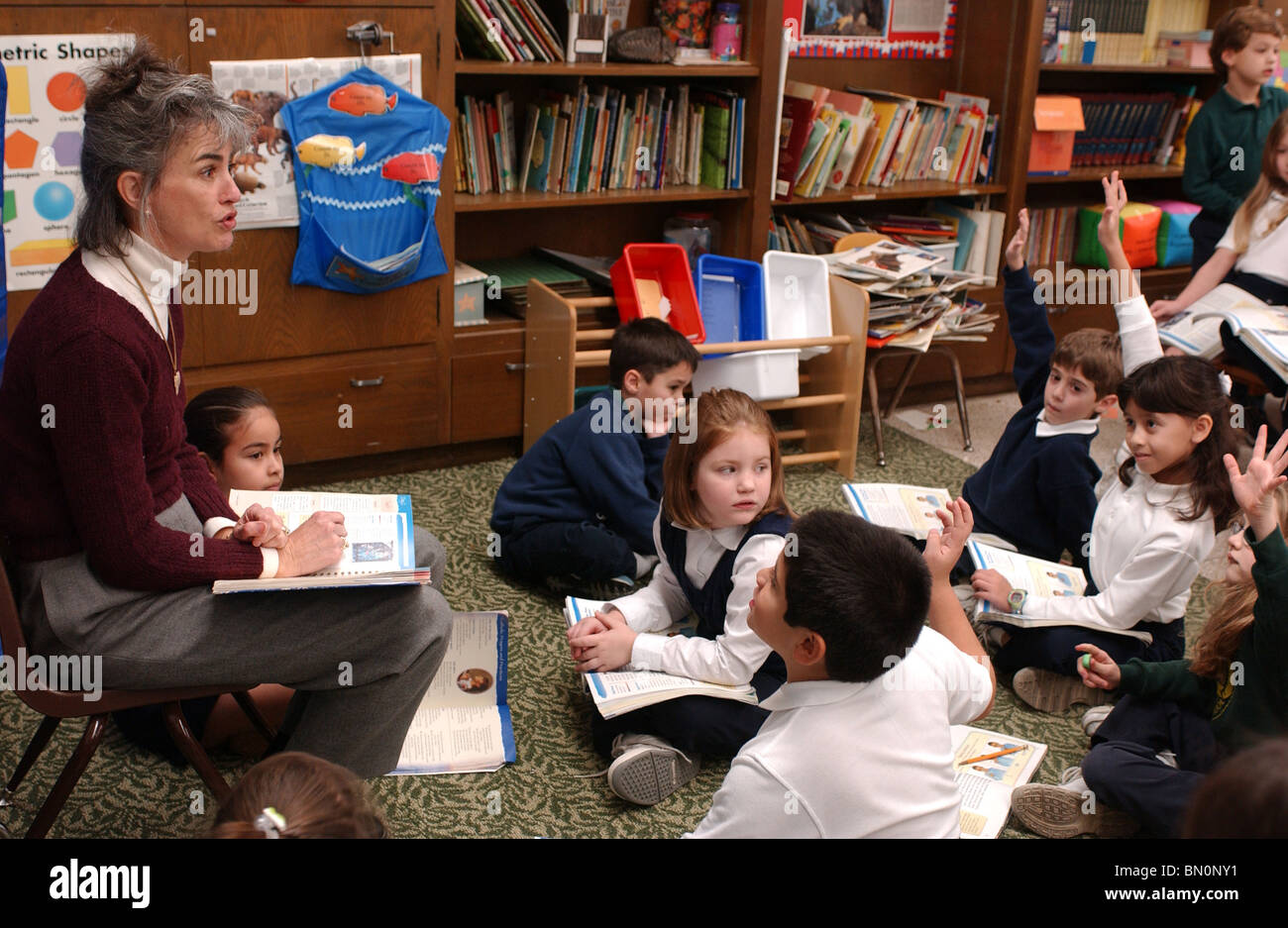 Female teacher leads activity at St. Ignatius Catholic Martyr School ...
