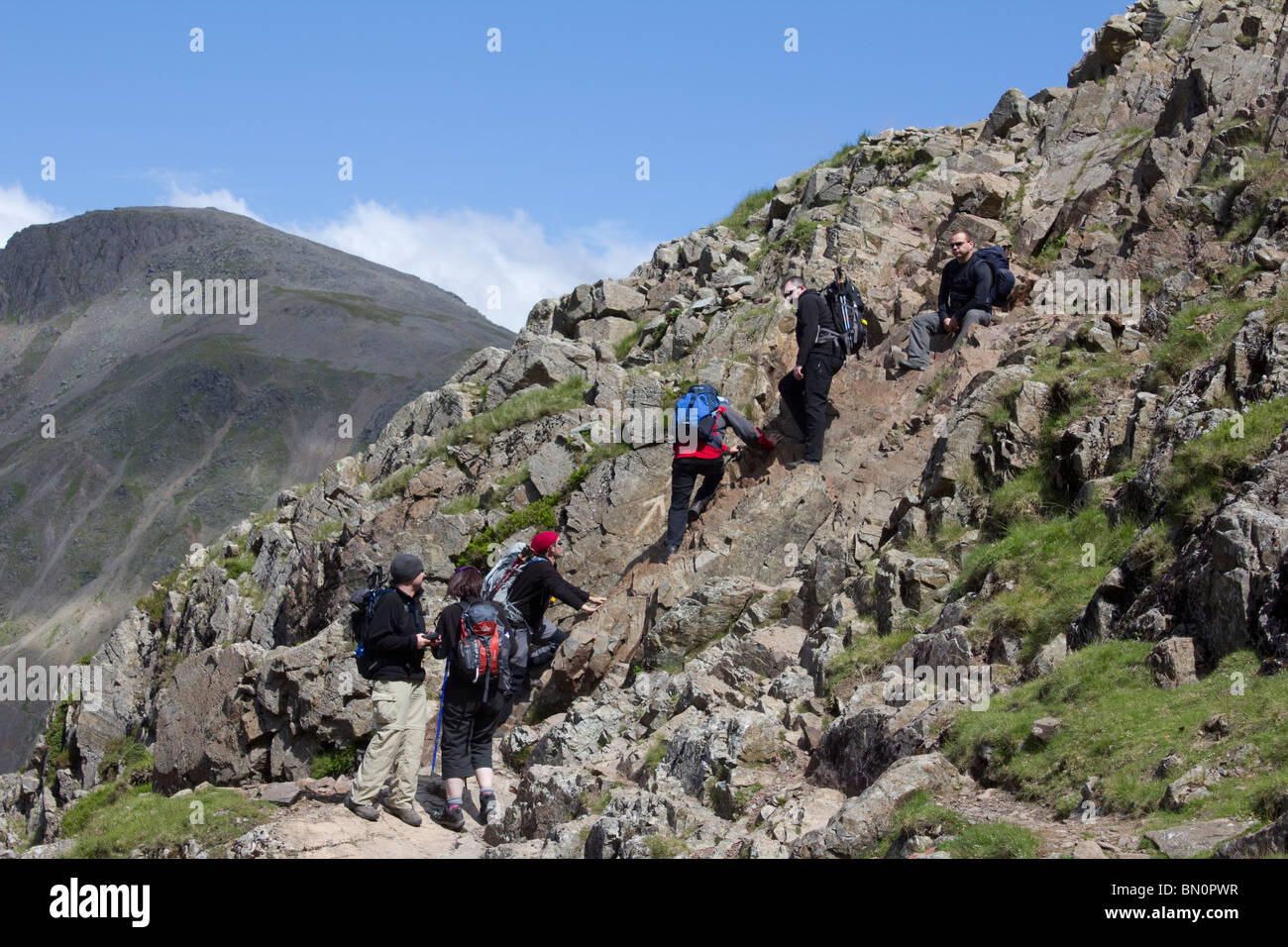 Walkers on treacherous rocks Round How, Styhead path Lake District ...