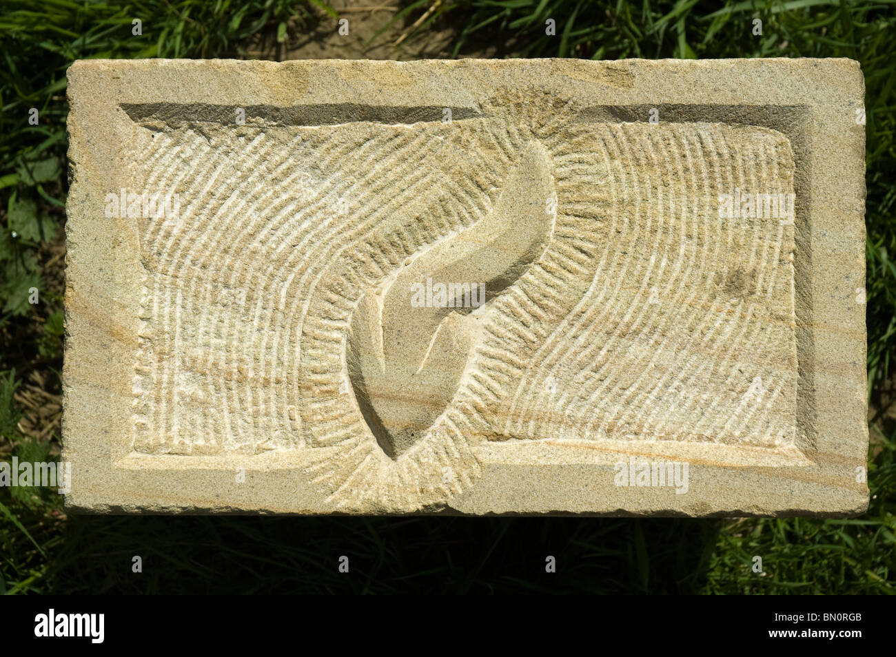Carved stone waymark on a footpath near the village of Wray, near ...