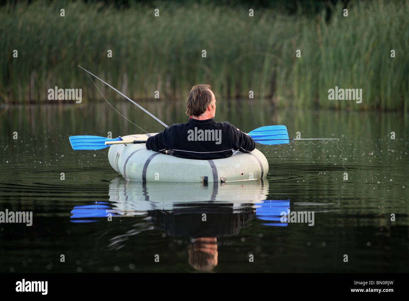 Man dinghy back view hi-res stock photography and images - Alamy
