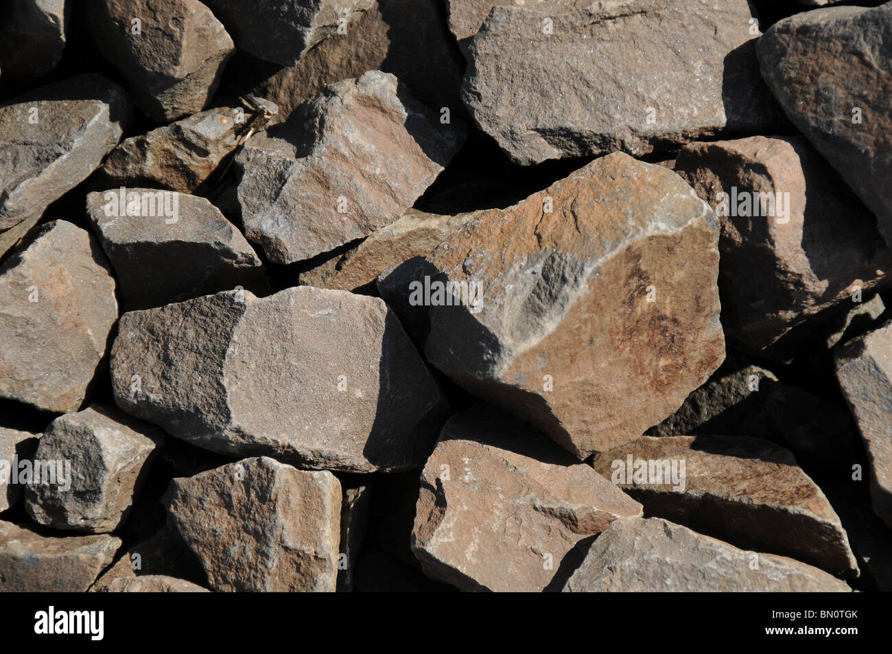 Brown clunky stones abstract background. These rocks are rough, not ...