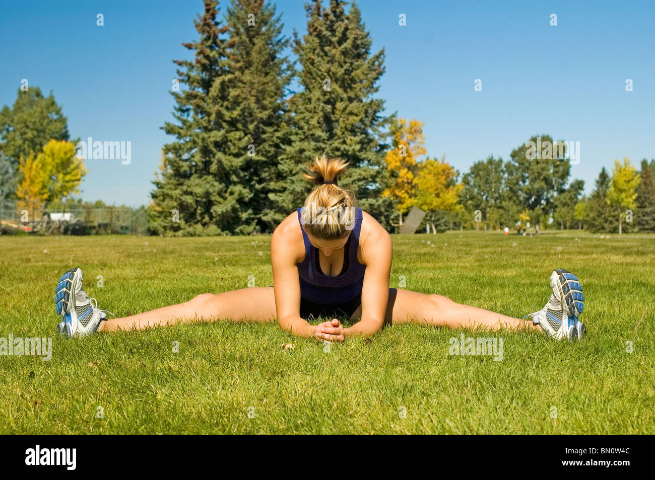 Groin and hamstring stretching legs Stock Photo - Alamy