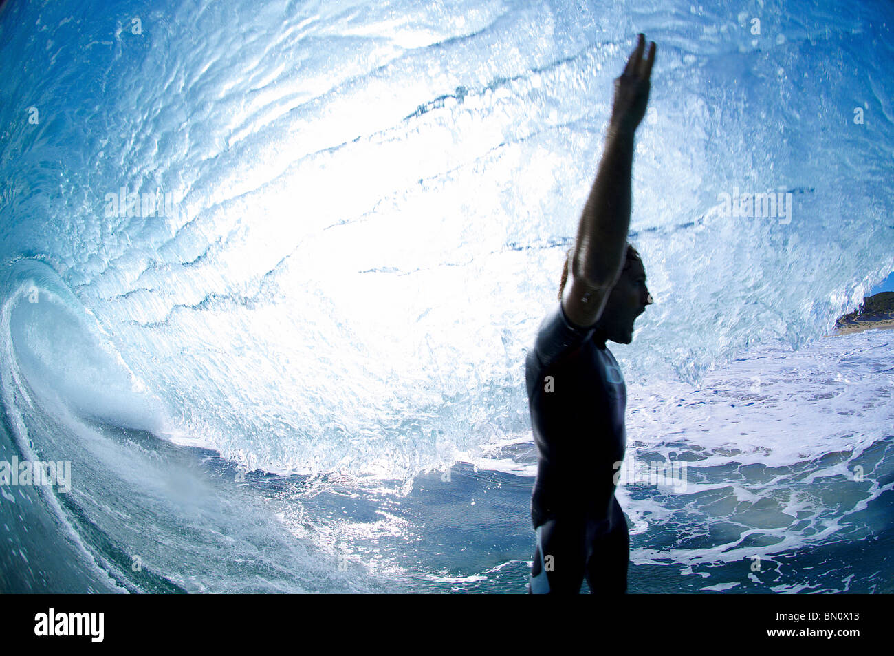 Silhouette surfer riding inside wave hi-res stock photography and ...