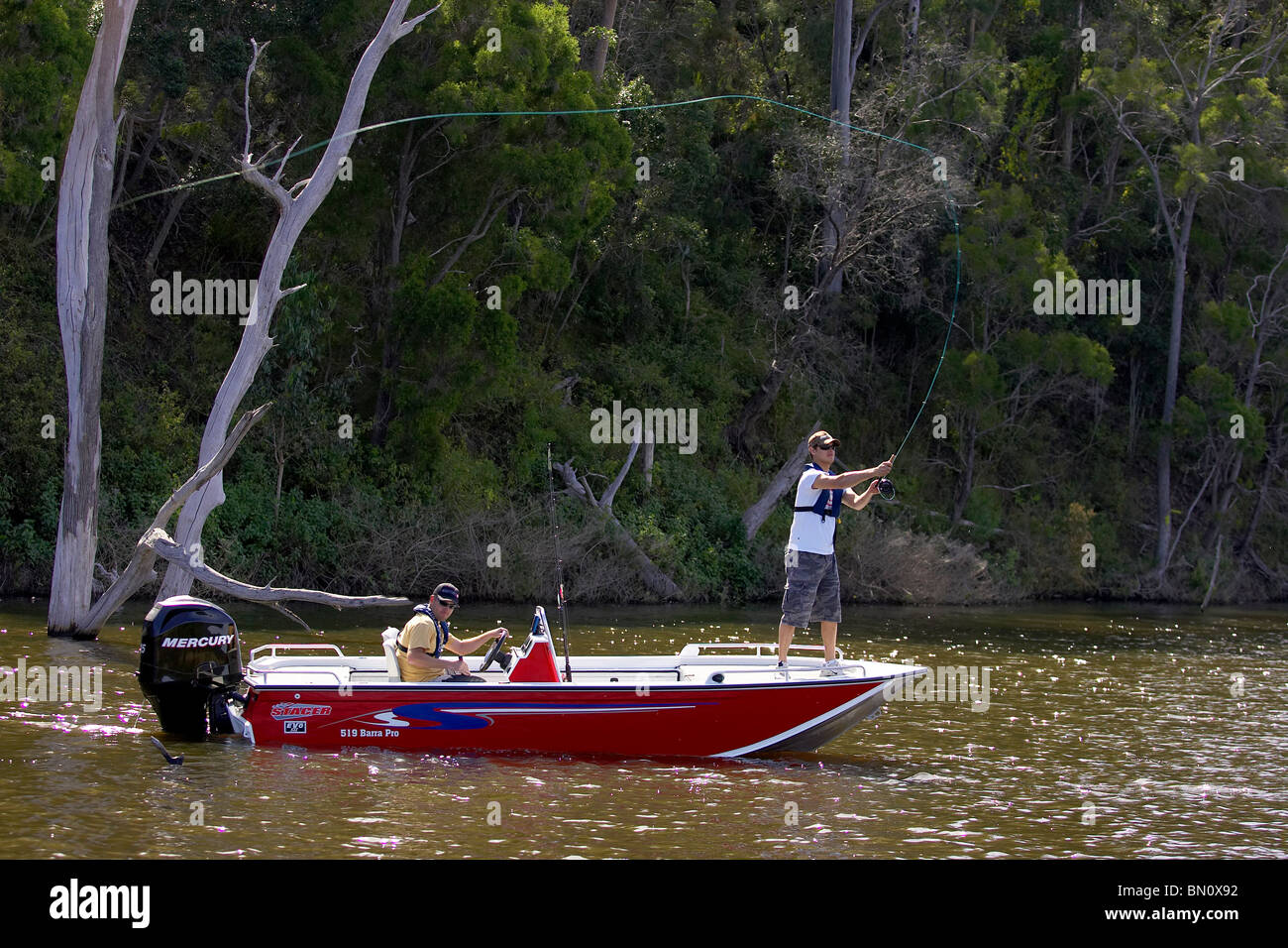 Two men fishing from a boat hi-res stock photography and images - Alamy