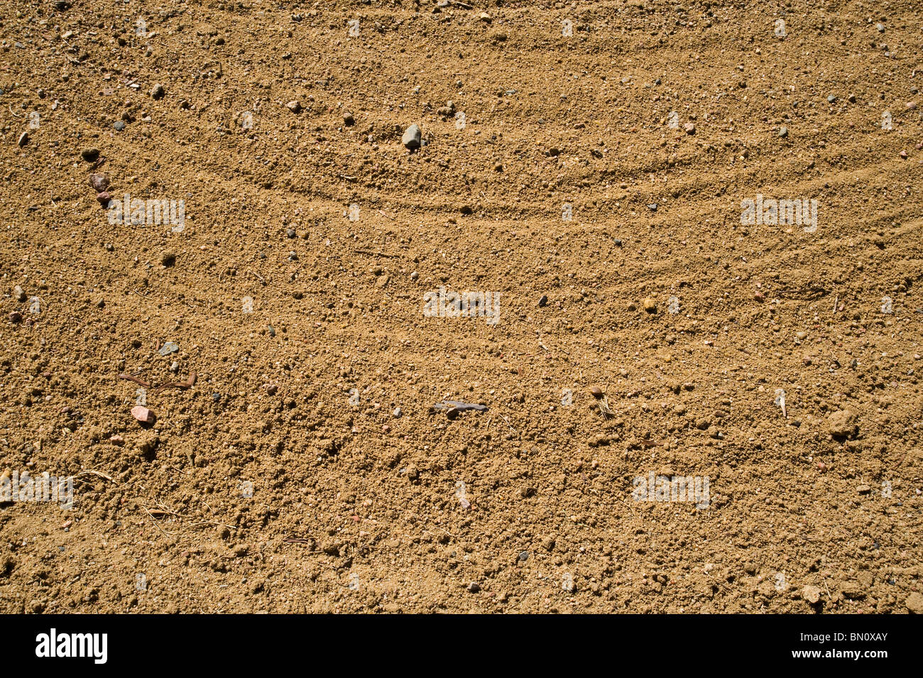 Course sand in a bunker of a golf course creating a background texture ...