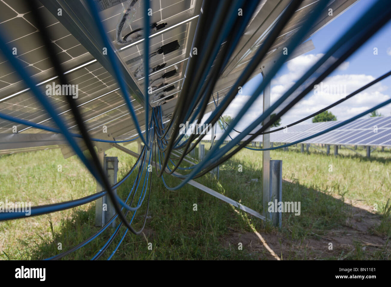 Solar panels below power cables hi-res stock photography and images - Alamy