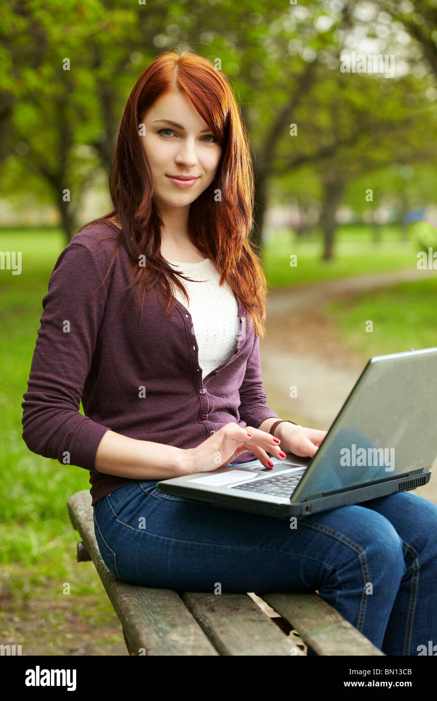 The girl with laptop on outdoor Stock Photo - Alamy