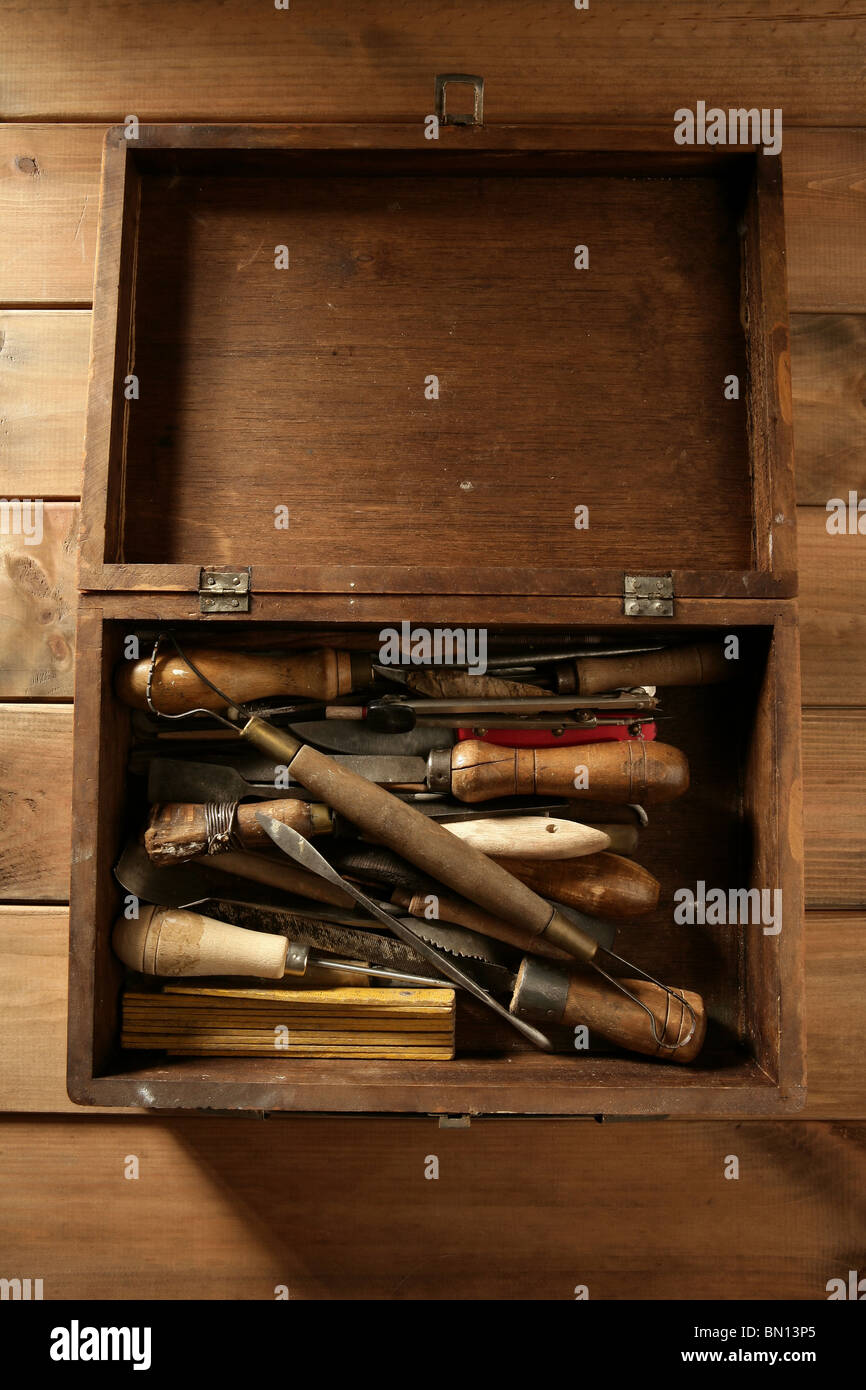 artist hand tools for handcraft works on golden wood background Stock ...