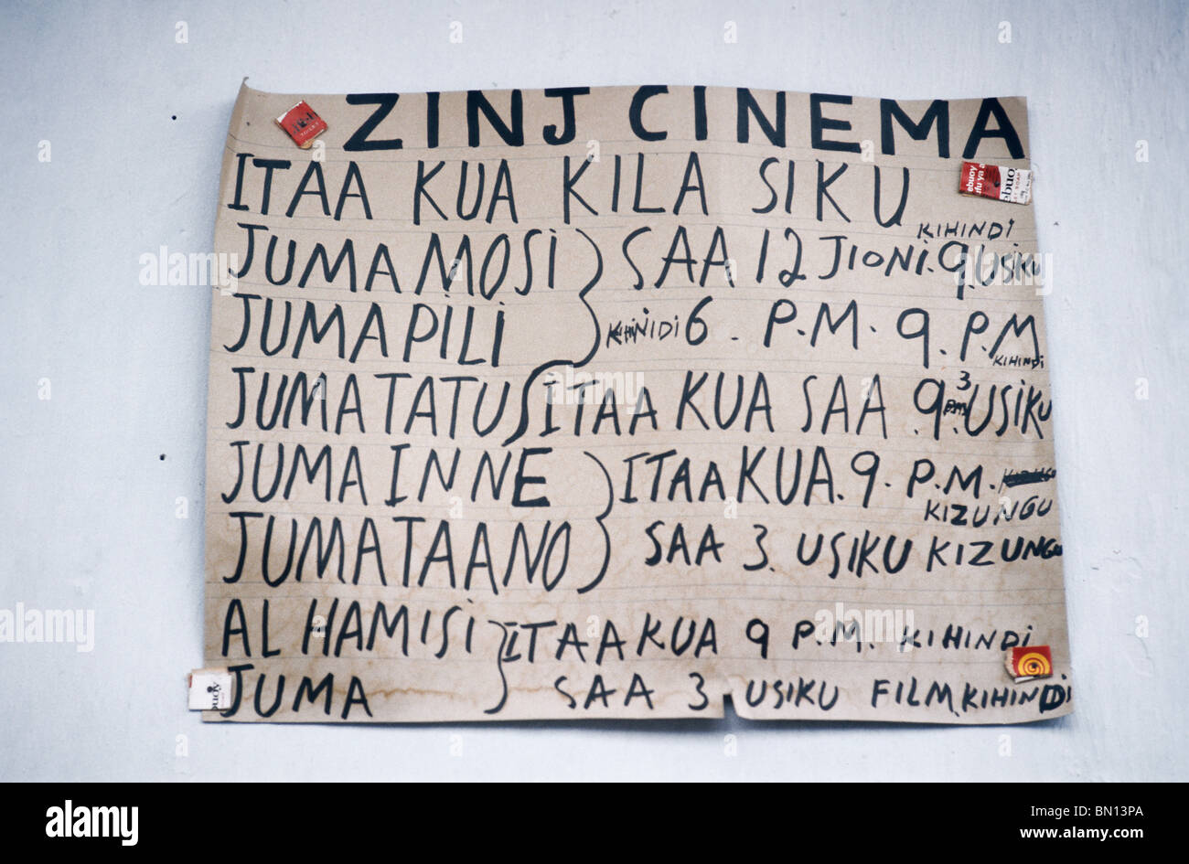Performance times notice displayed at a Zanzibar cinema Stock Photo - Alamy