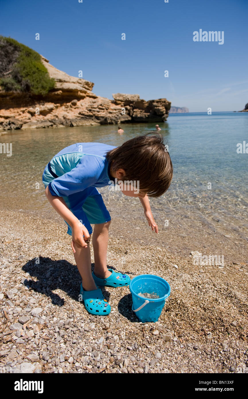 Collecting stone child hi-res stock photography and images - Alamy