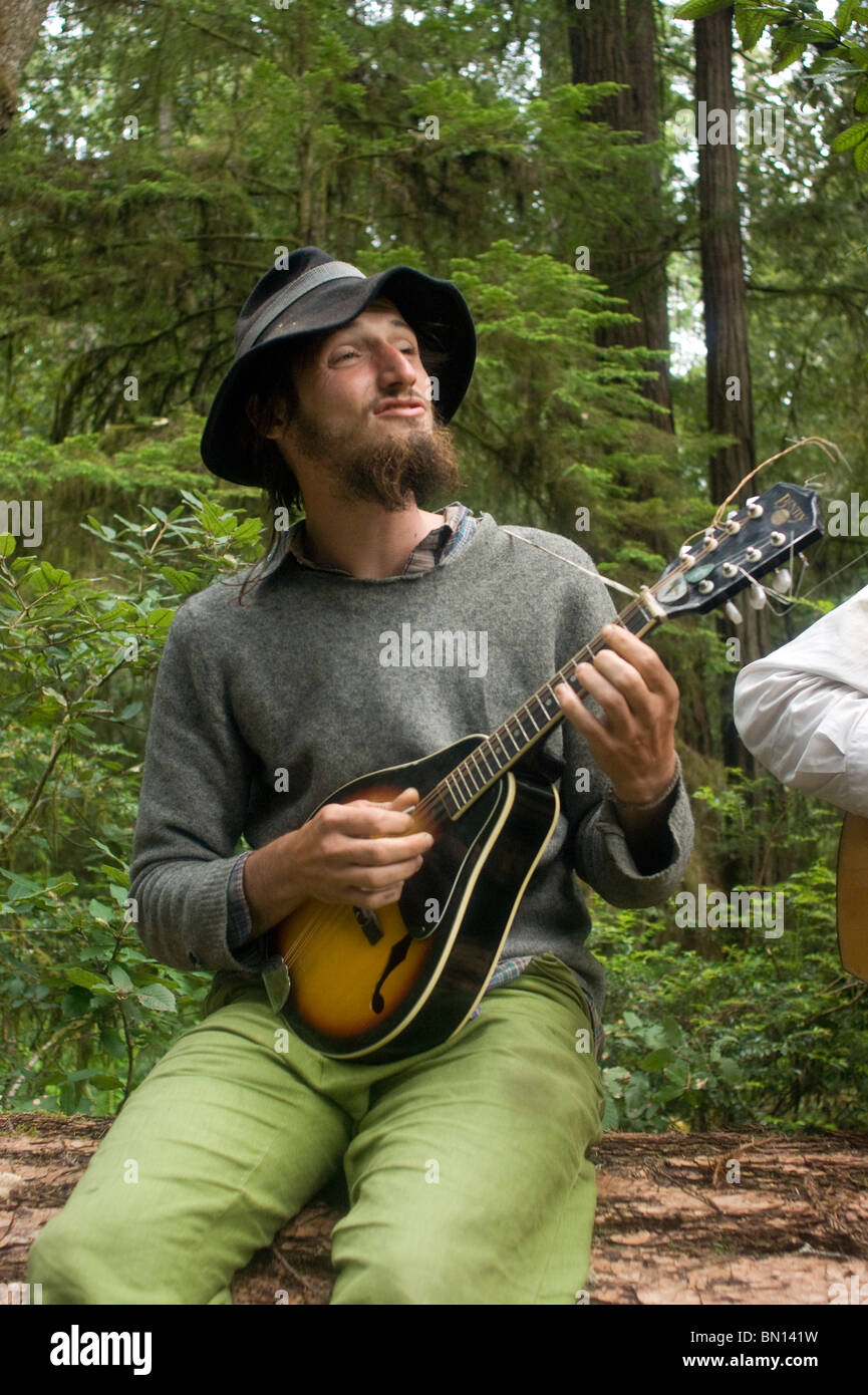 Camping Musicians play guitar and sing a tune in the Redwoods Stock ...