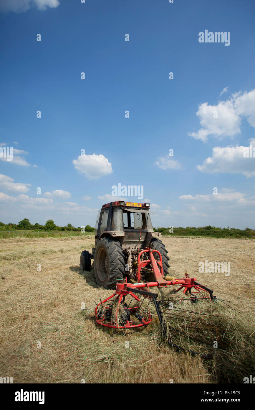 rotary rake and tractor Stock Photo - Alamy