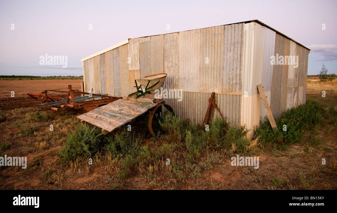 Old farm shed and machinery in rural Australia at dusk Stock Photo - Alamy