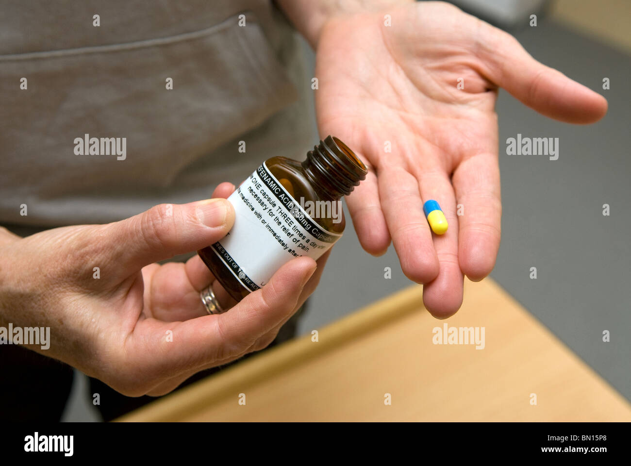 Woman with medicine pills for disabled daughter (cerebral palsy ...