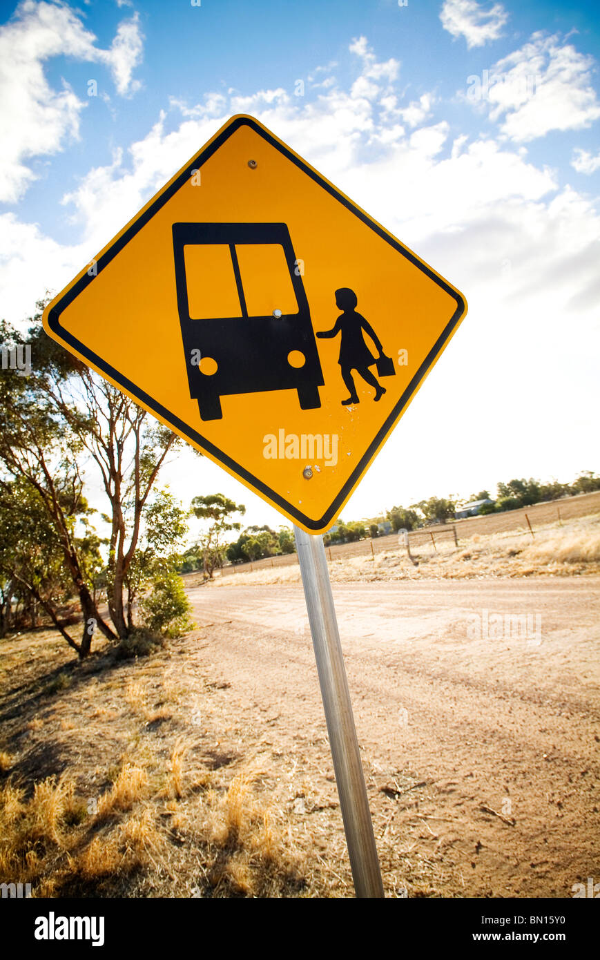 Warning sign for a bus stop in rural area Stock Photo - Alamy