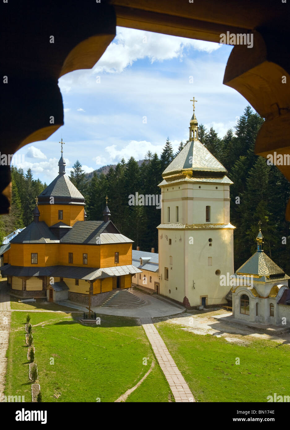 Christian orthodox monastery Courtyard view through the wooden log ...