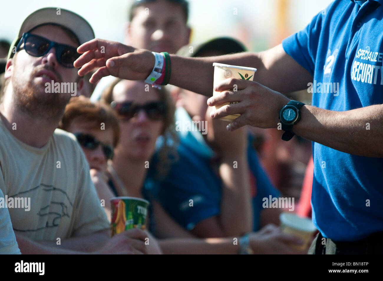 Handing out water, Glastonbury 2010 Stock Photo - Alamy