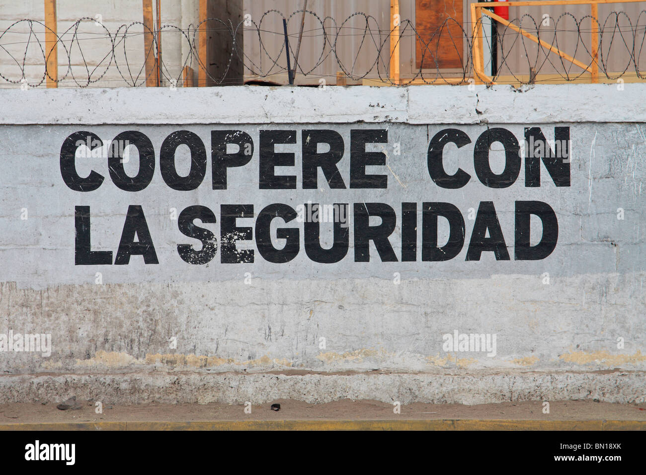 Security sign, near the port at Iquique, northern Chile Stock Photo - Alamy