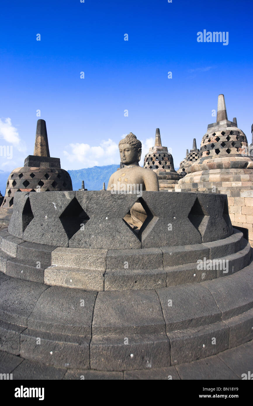 Buddha statue in stupa. Borobudur. Java. Indonesia Stock Photo - Alamy