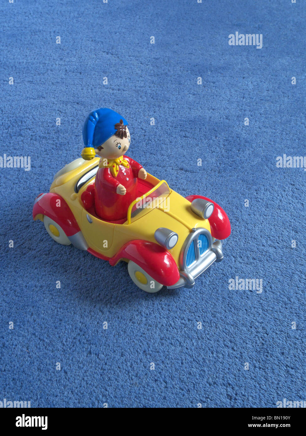 Plastic Toy Noddy Car on Carpeted Floor Stock Photo - Alamy