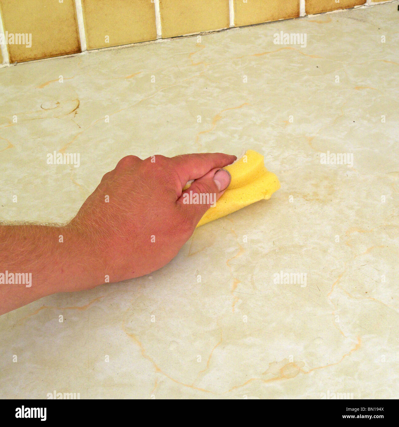 Caucasian Male Wiping up Mess on a Kitchen Work Surface, UK MODEL ...