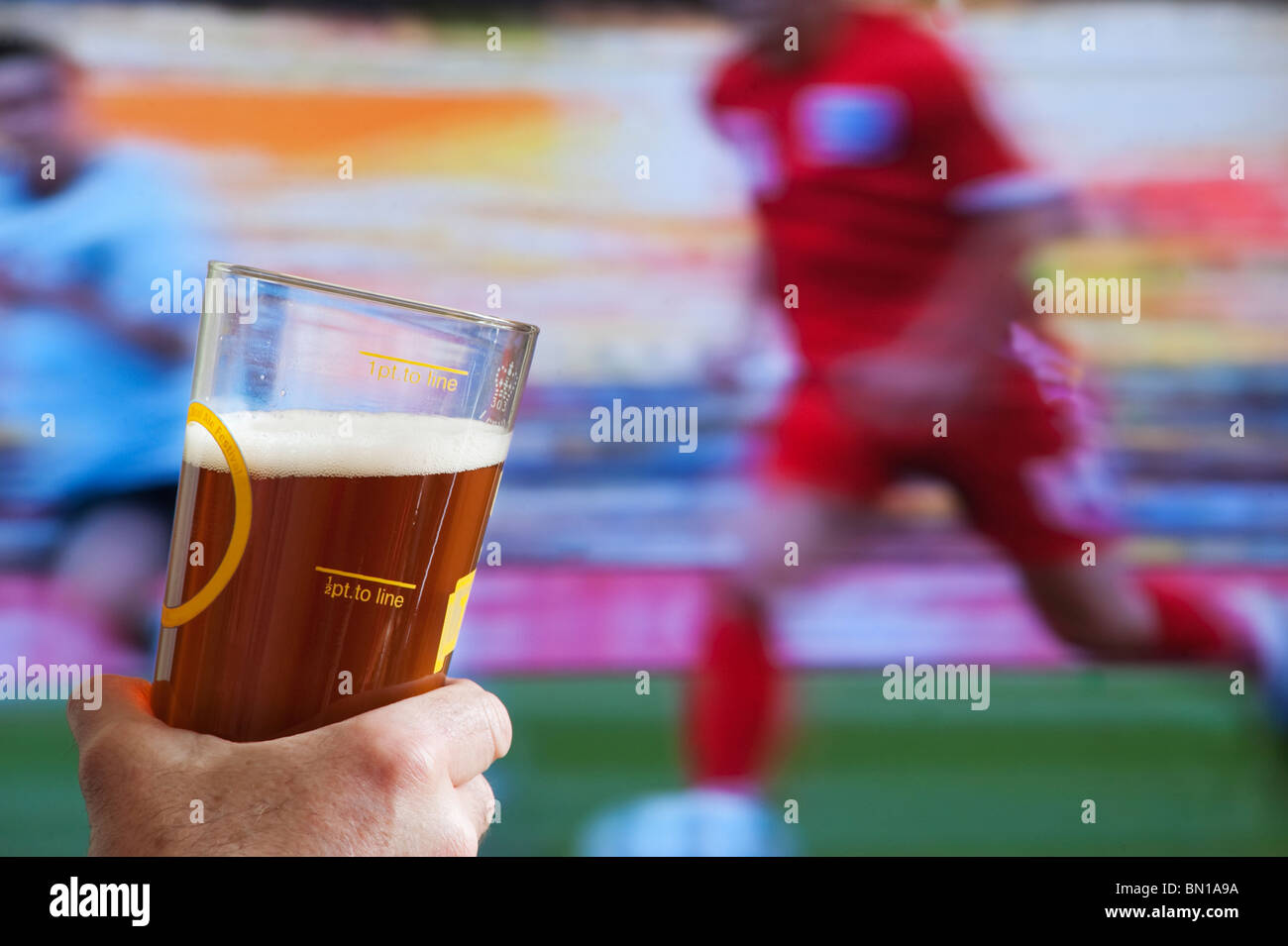 England fan watching Germany v England world cup match on pub screen ...