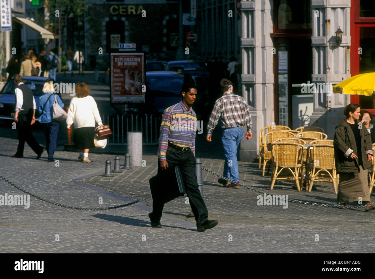 Belgian people person of color young adult man walking in Grand Place ...