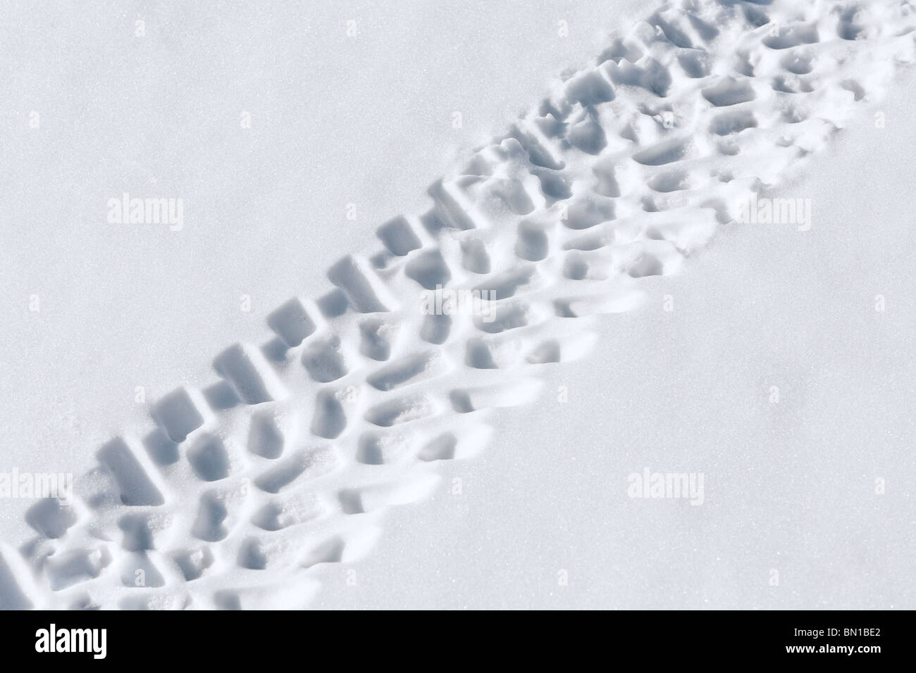 Tire tracks in the snow Stock Photo - Alamy