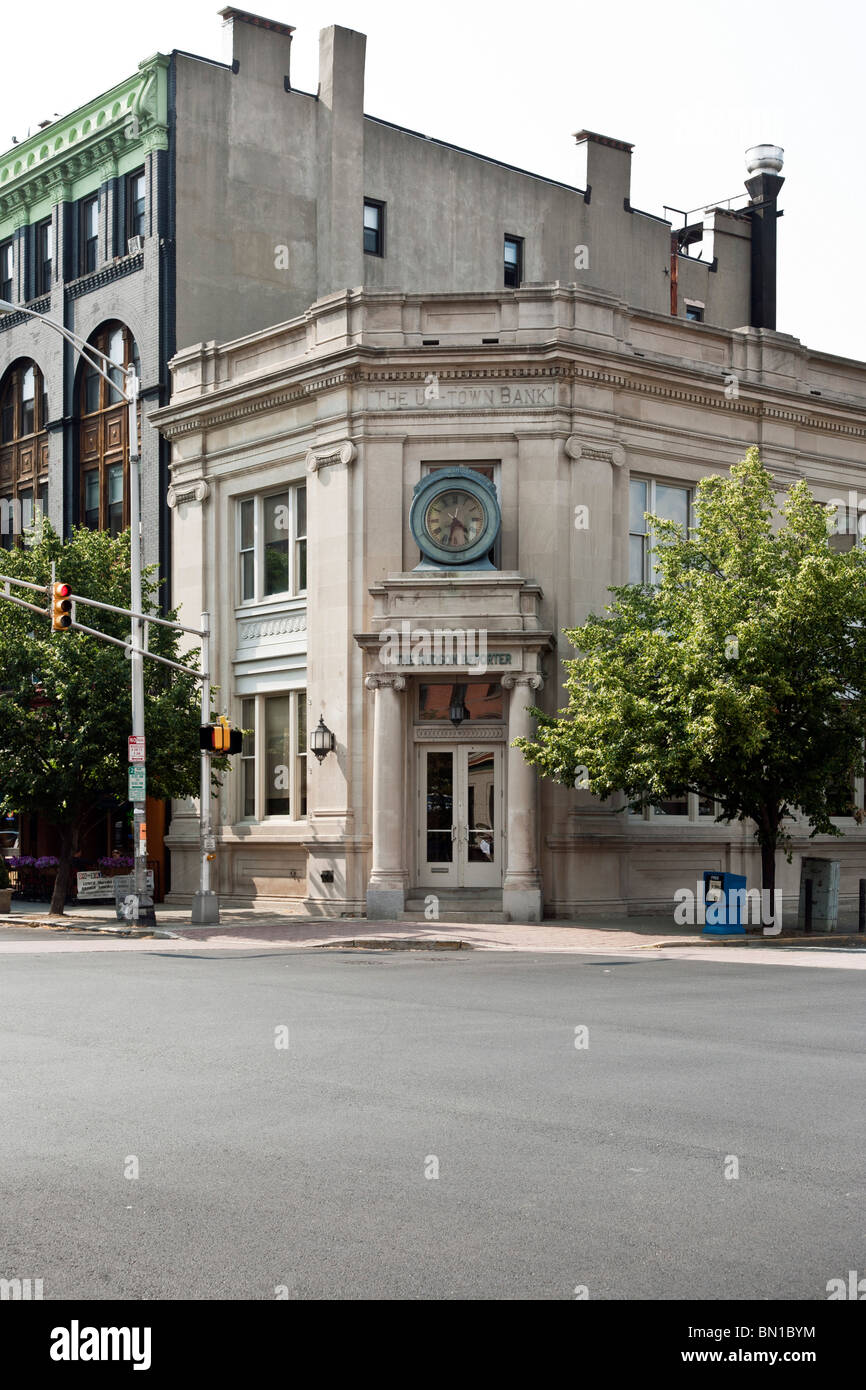 street corner with fine old masonry buildings, one a bank converted to ...