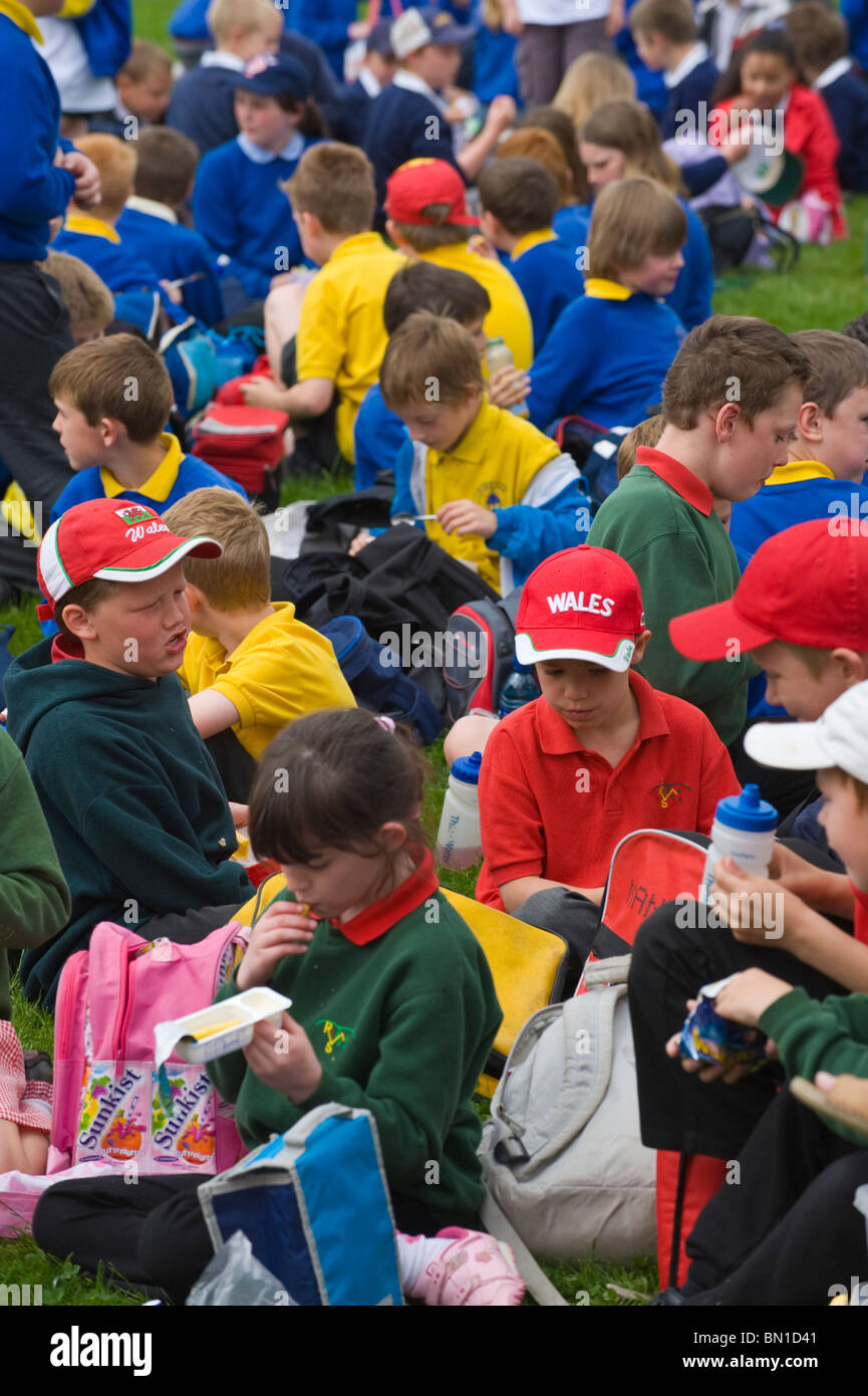 Schools eating lunch on the grass at Hay Festival Primary Schools Day ...