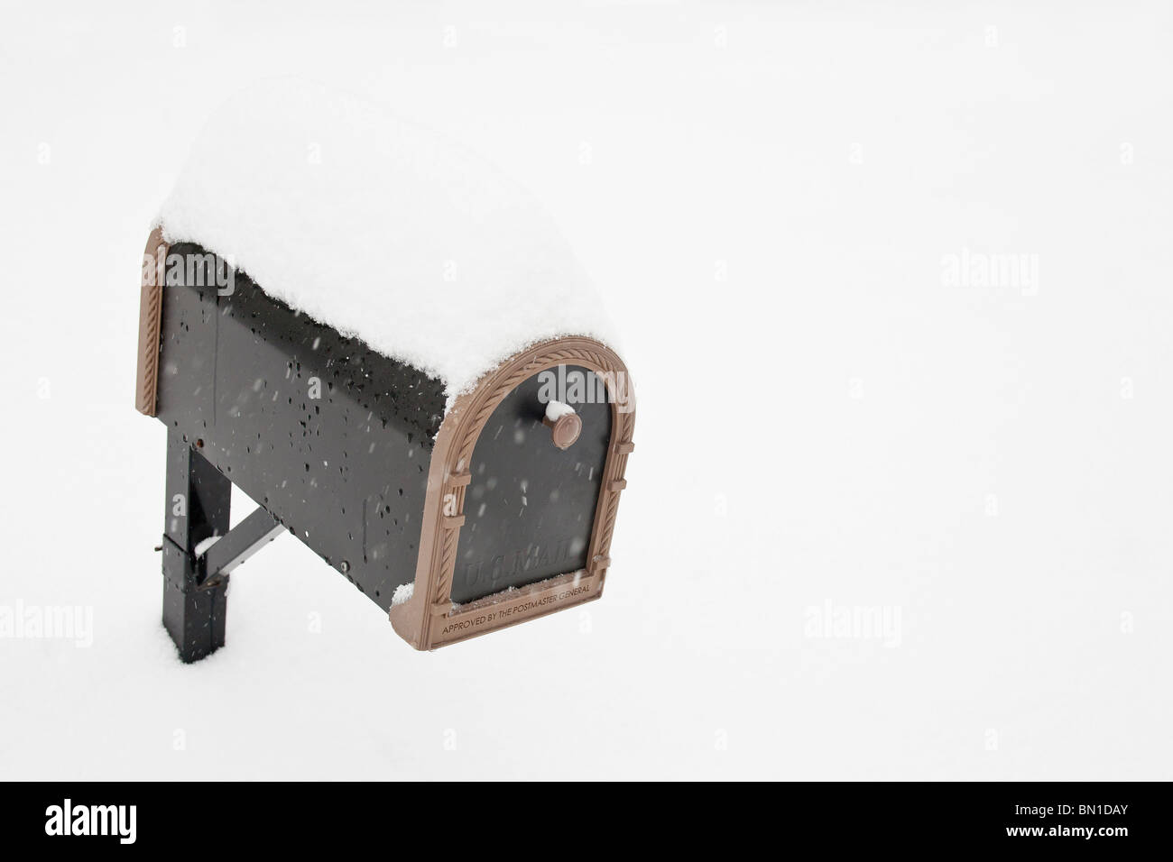 A mailbox covered in snow Stock Photo - Alamy