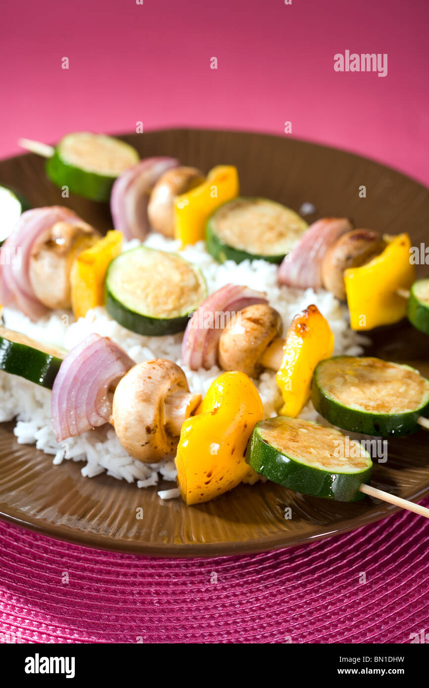 Grilled Vegetable Shish Kabobs on Plate of White Rice Stock Photo - Alamy