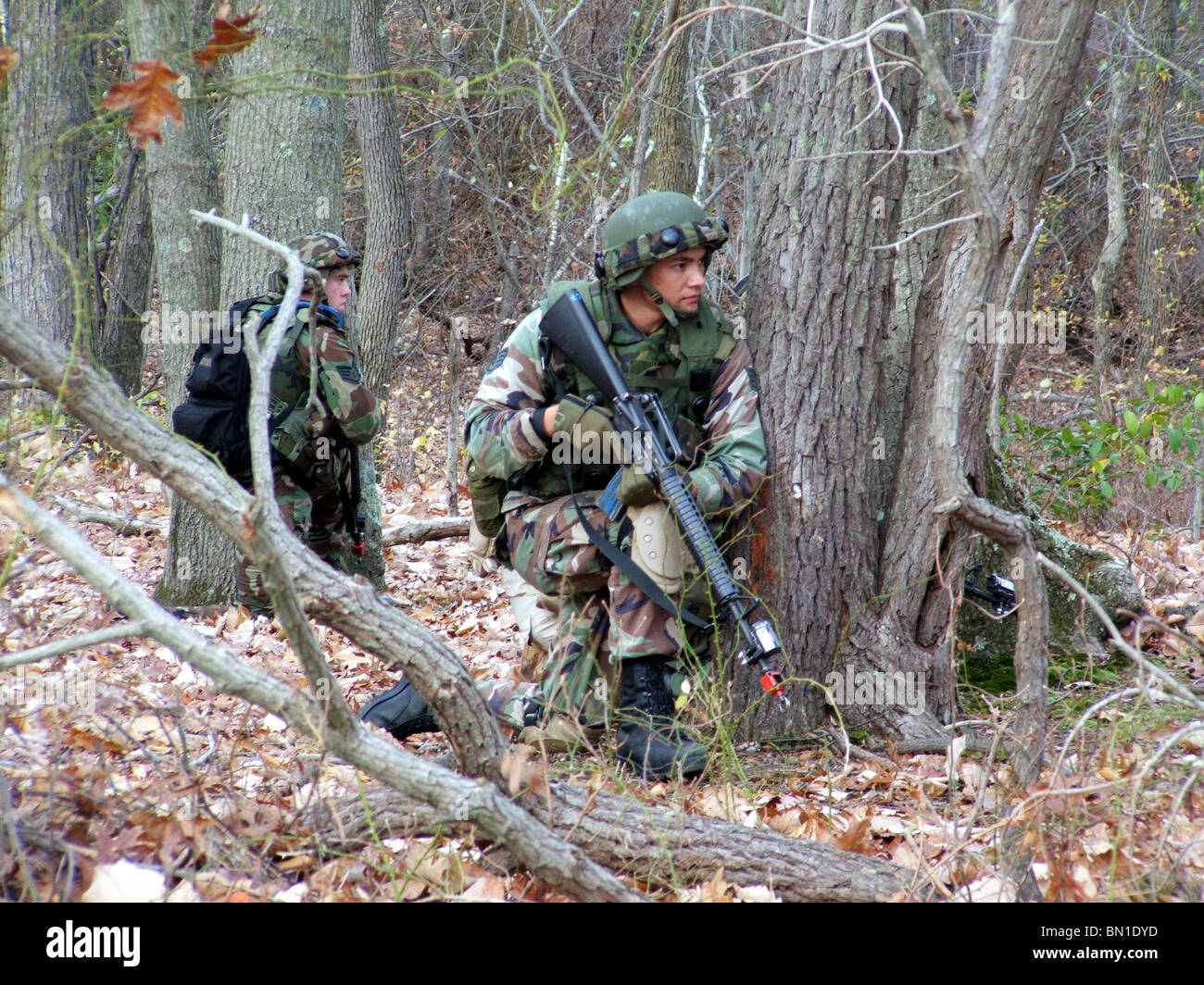 U.S. Air Force pause and take a position during a patrol scenario ...