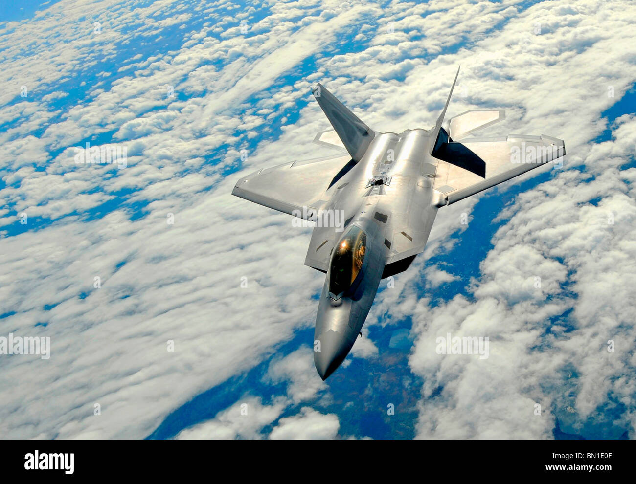 An F-22 Raptor from Elmendorf Air Force Base, Alaska, drops back after ...