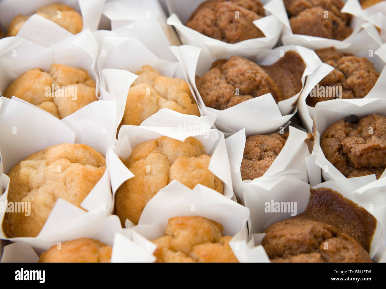 delicious mixed fresh mini muffin cakes background Stock Photo - Alamy
