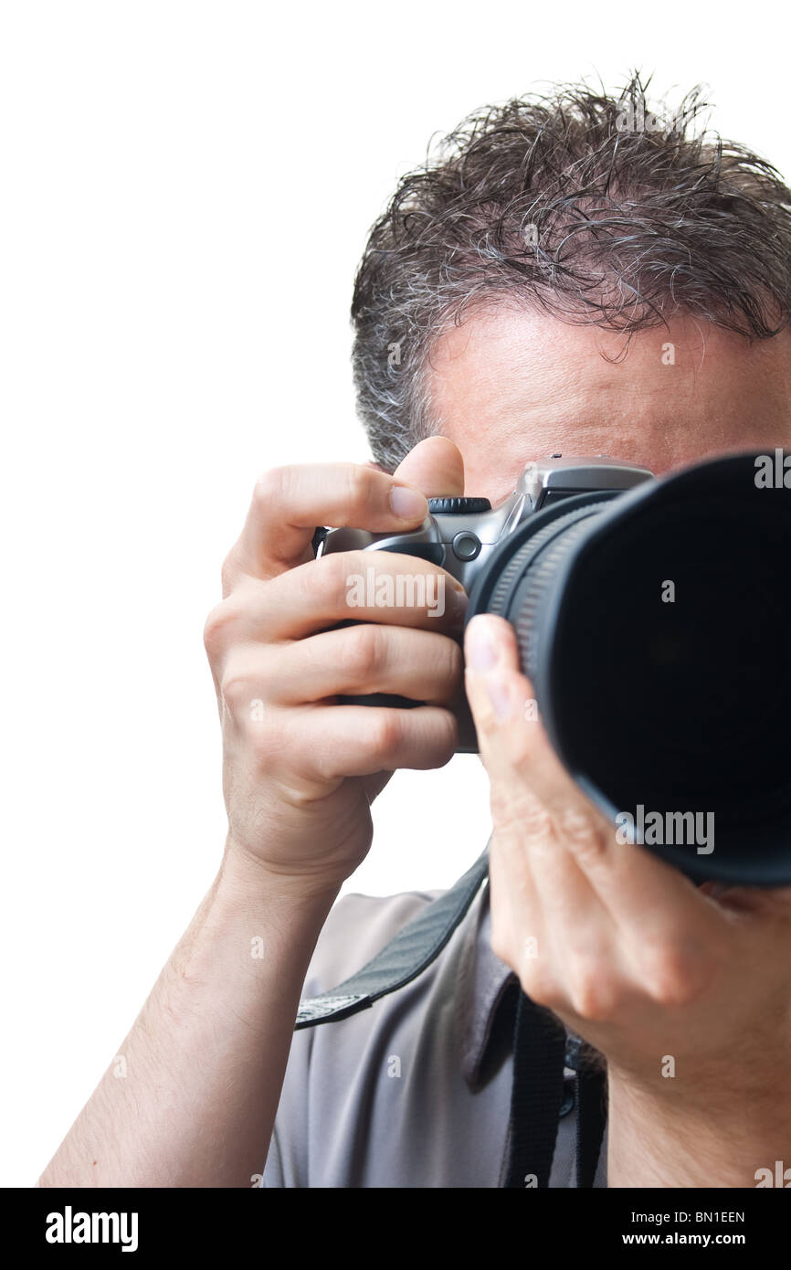Looking into a telephoto lens, with a photographer behind, finger on ...