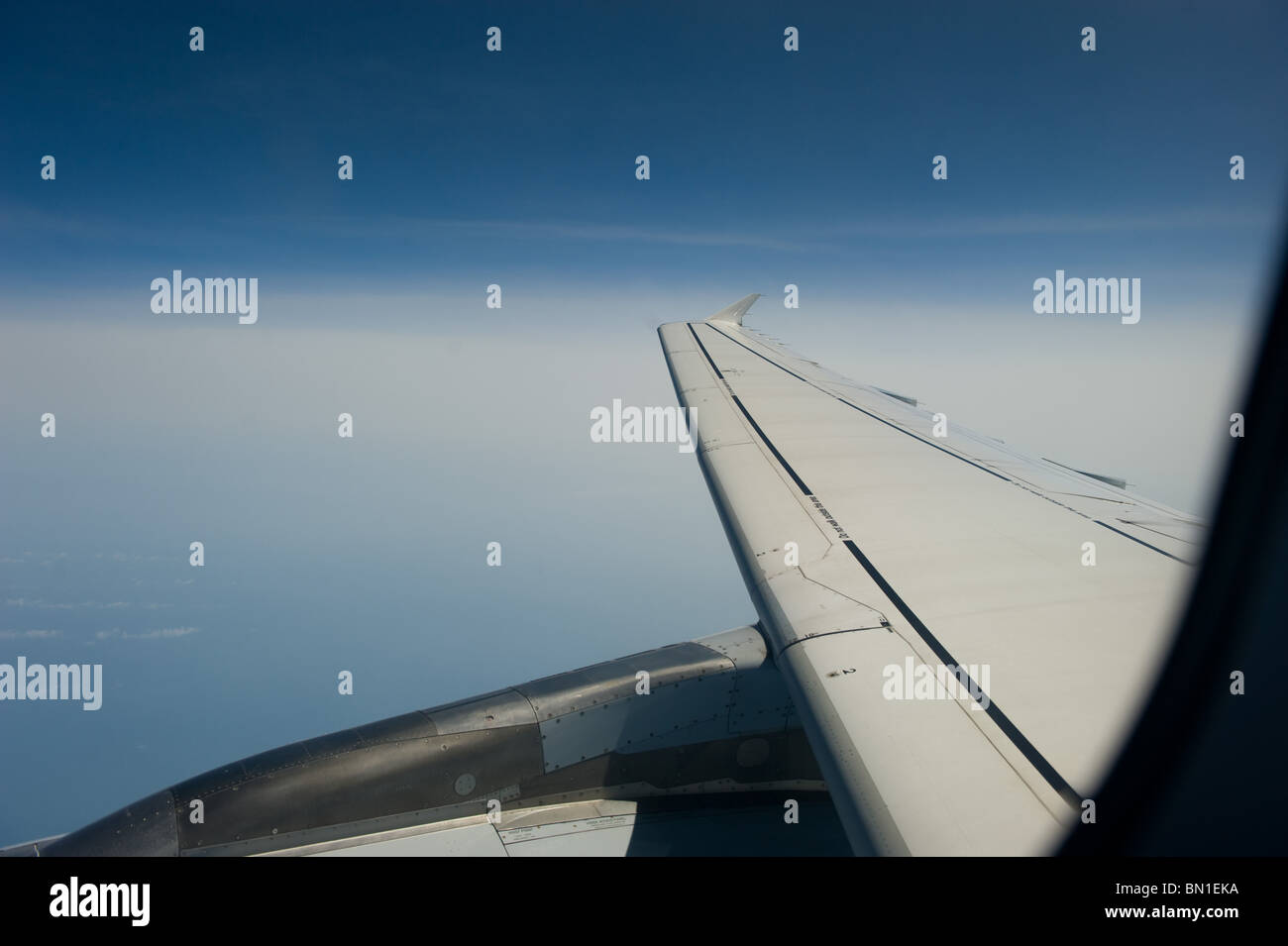 The view from the window of a passenger jet showing the engine and wing ...