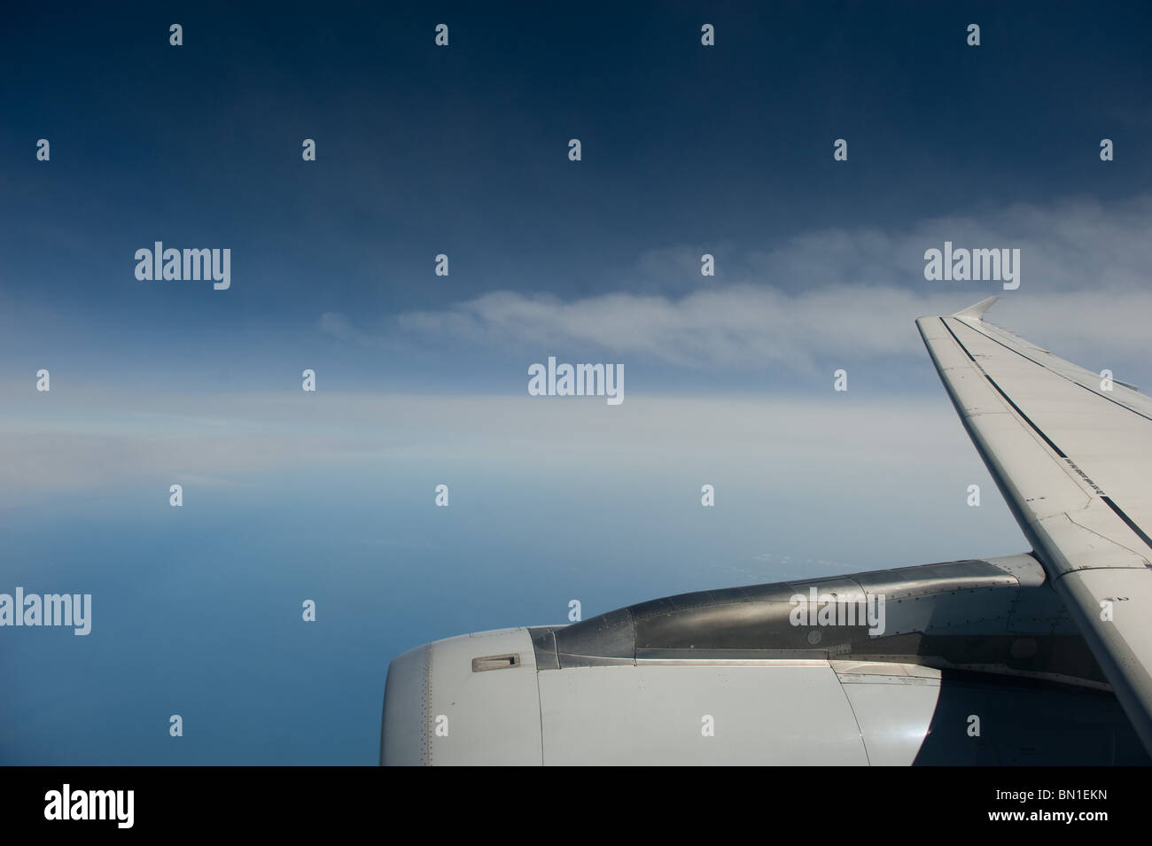 The view through the window of a commercial airliner showing blue sky ...