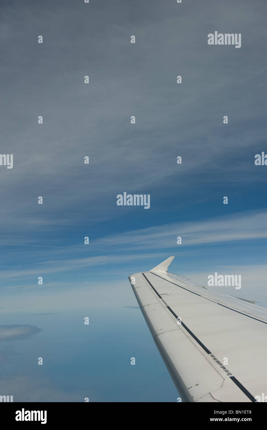 The view from the window of a passenger jet showing the engine and wing ...