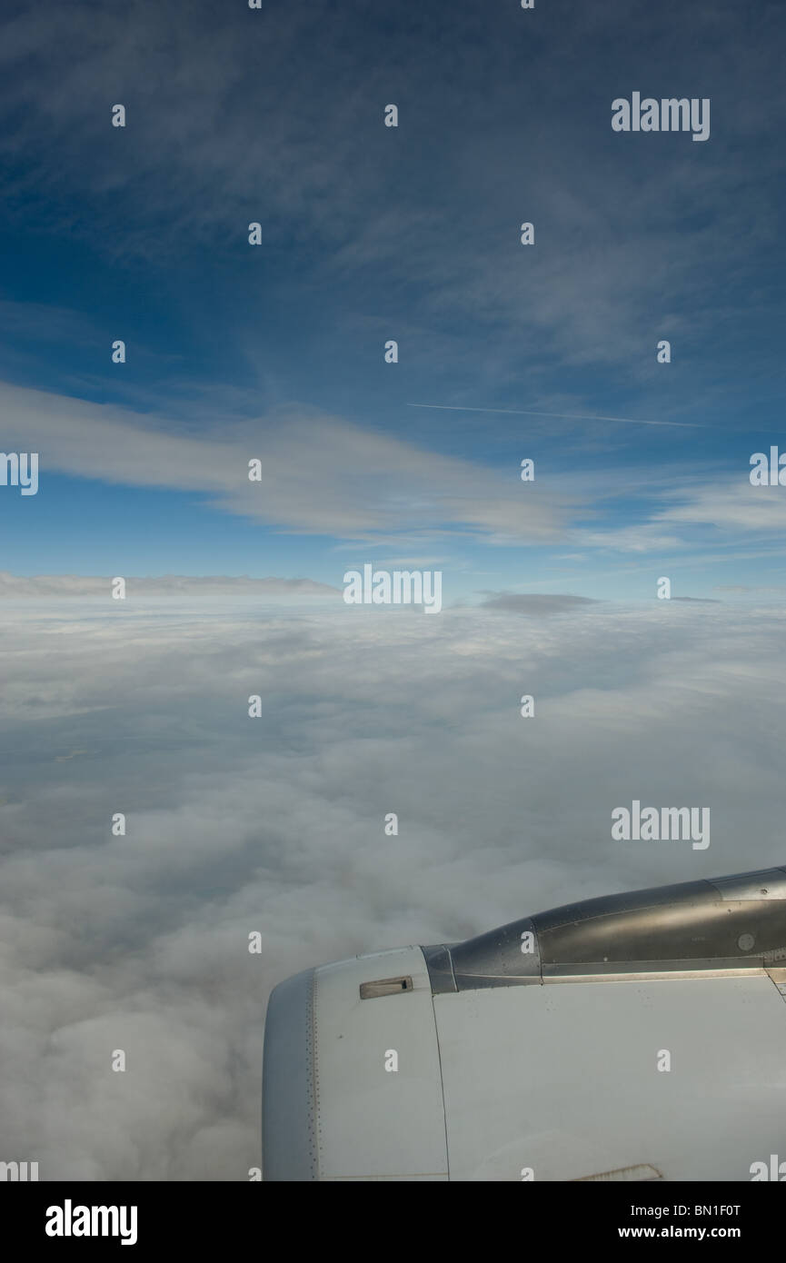 The view through the window of a commercial airliner showing blue sky ...
