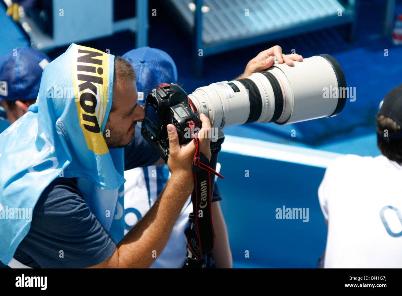 photographer with long lens camera at world swimming championships ...