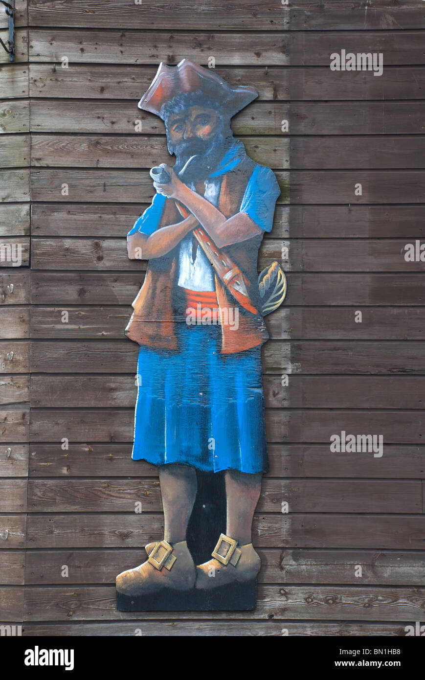 Buccaneer figure on wooden slatted harbour building, Penzance, Cornwall ...