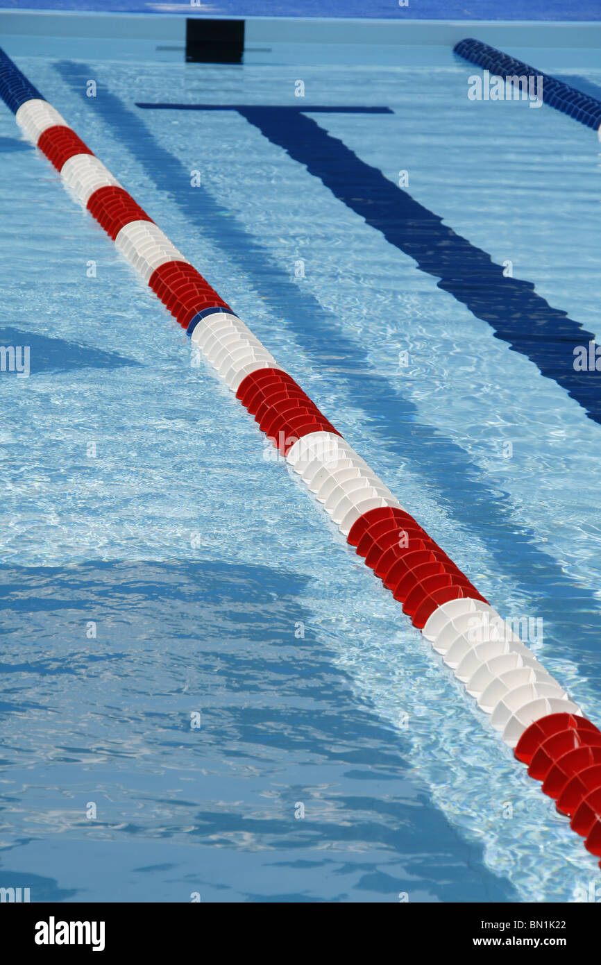 empty olympic type swimming pool with lanes Stock Photo - Alamy
