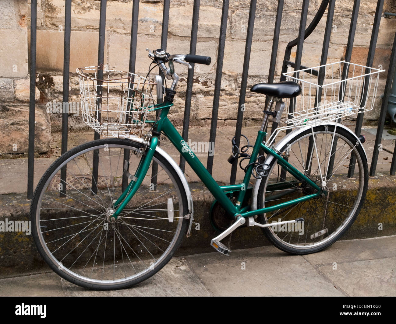 A bicycle chained to railings with a combination lock in Newark on ...