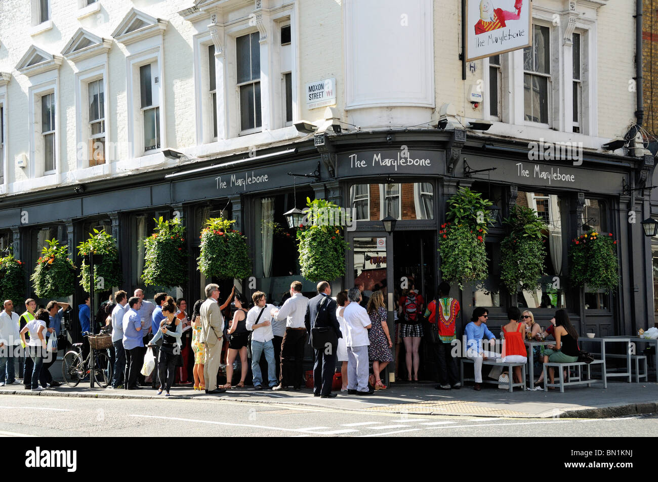 Crowd of people outside The Marylebone public house and wine bar ...